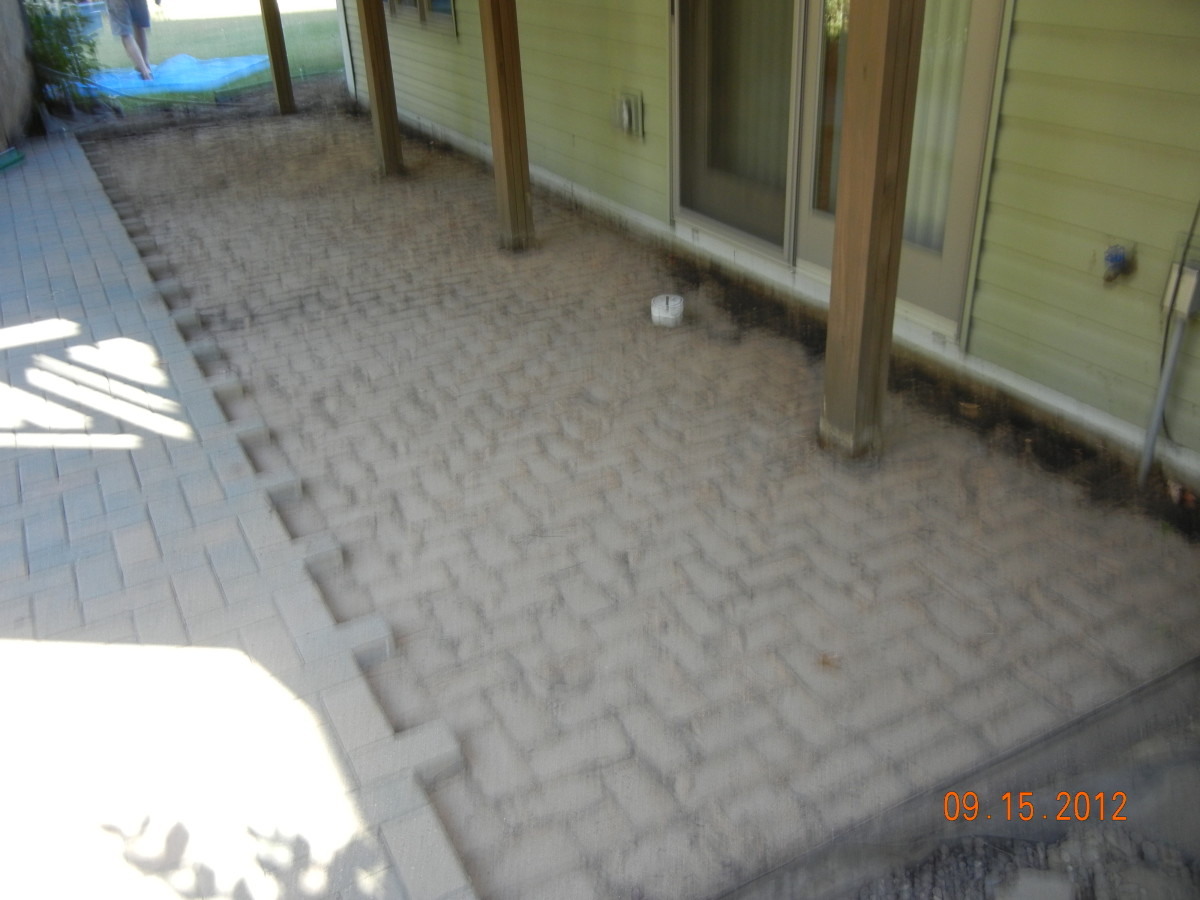 How to Lay Pavers for a Patio: Fixing a Brick Patio Yourself - Dengarden
